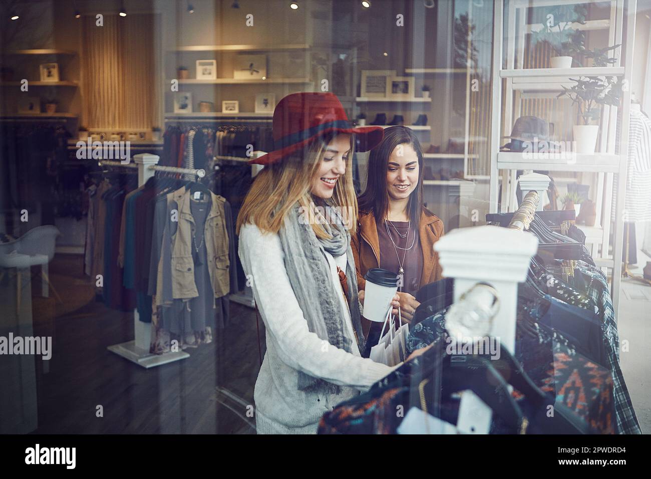 Theres always a reason to shop. two best friends out shopping in a ...