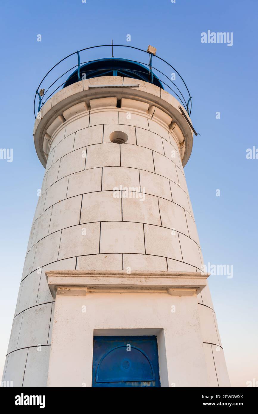 Bottom view of the Genoese lighthouse with a blue roof, from the pier ...