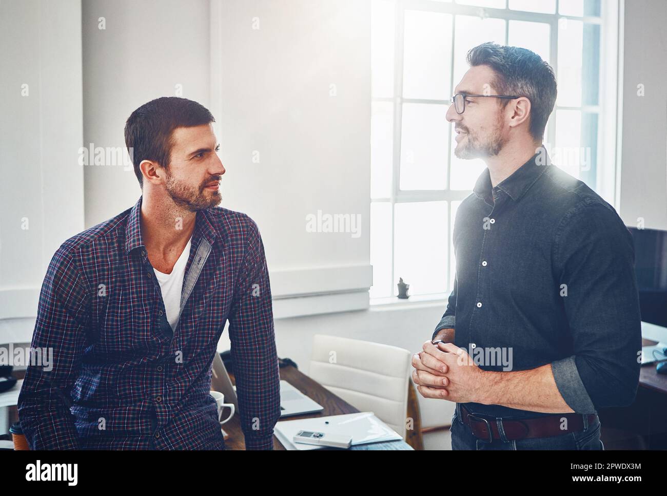 Make your mind deliver. colleagues talking in the office Stock Photo ...