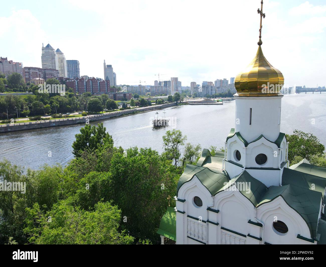 Beautiful white christian Orthodox church near river. Buildings and ...