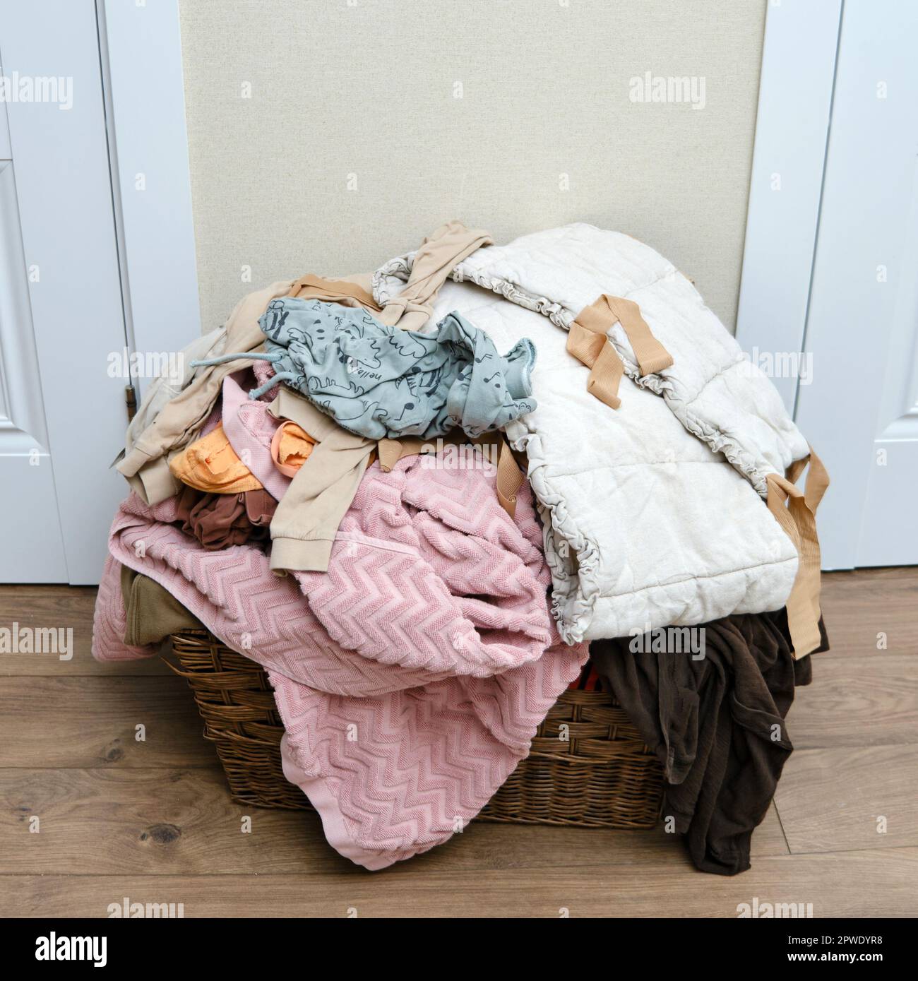 Filling the basket with adult and baby clothing. Sorting male and ...