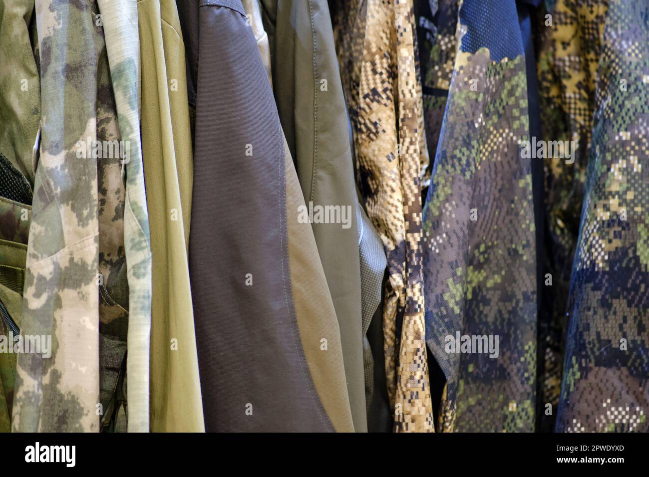 Army clothes on a hanger in a military goods storeArmy clothes on a ...