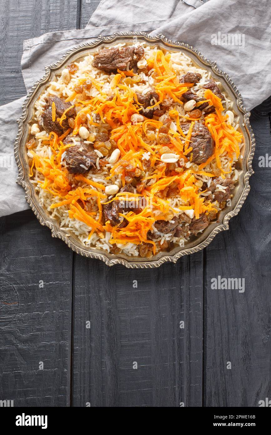 Delicious colorful Afghan rice pilaf Kabuli pulao with lamb and raisin ...