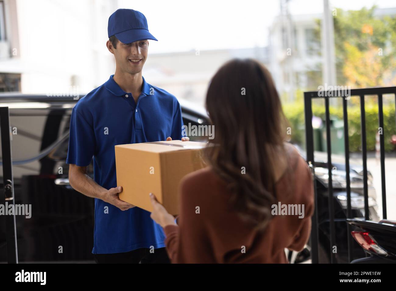Female vase seller processes orders, including delivery payments, with smartphone and quick ...