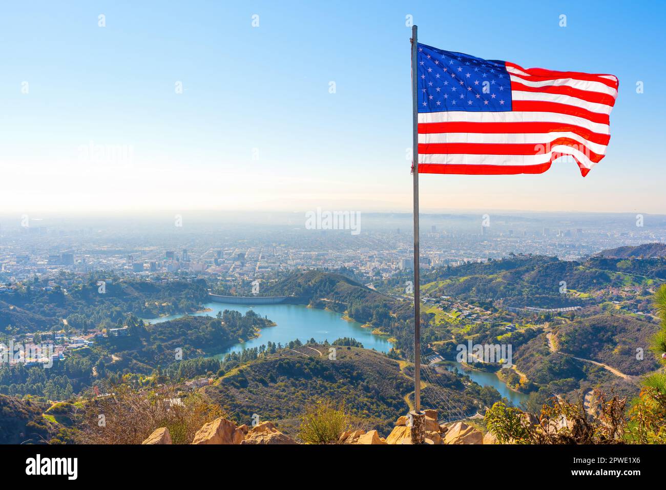 American flag waving in the wind, set against the stunning backdrop of ...