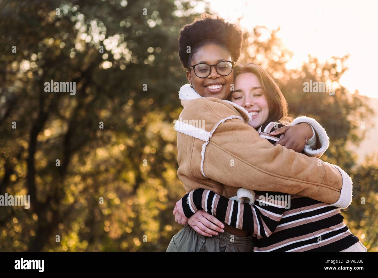 Black friends hugging hi-res stock photography and images - Alamy