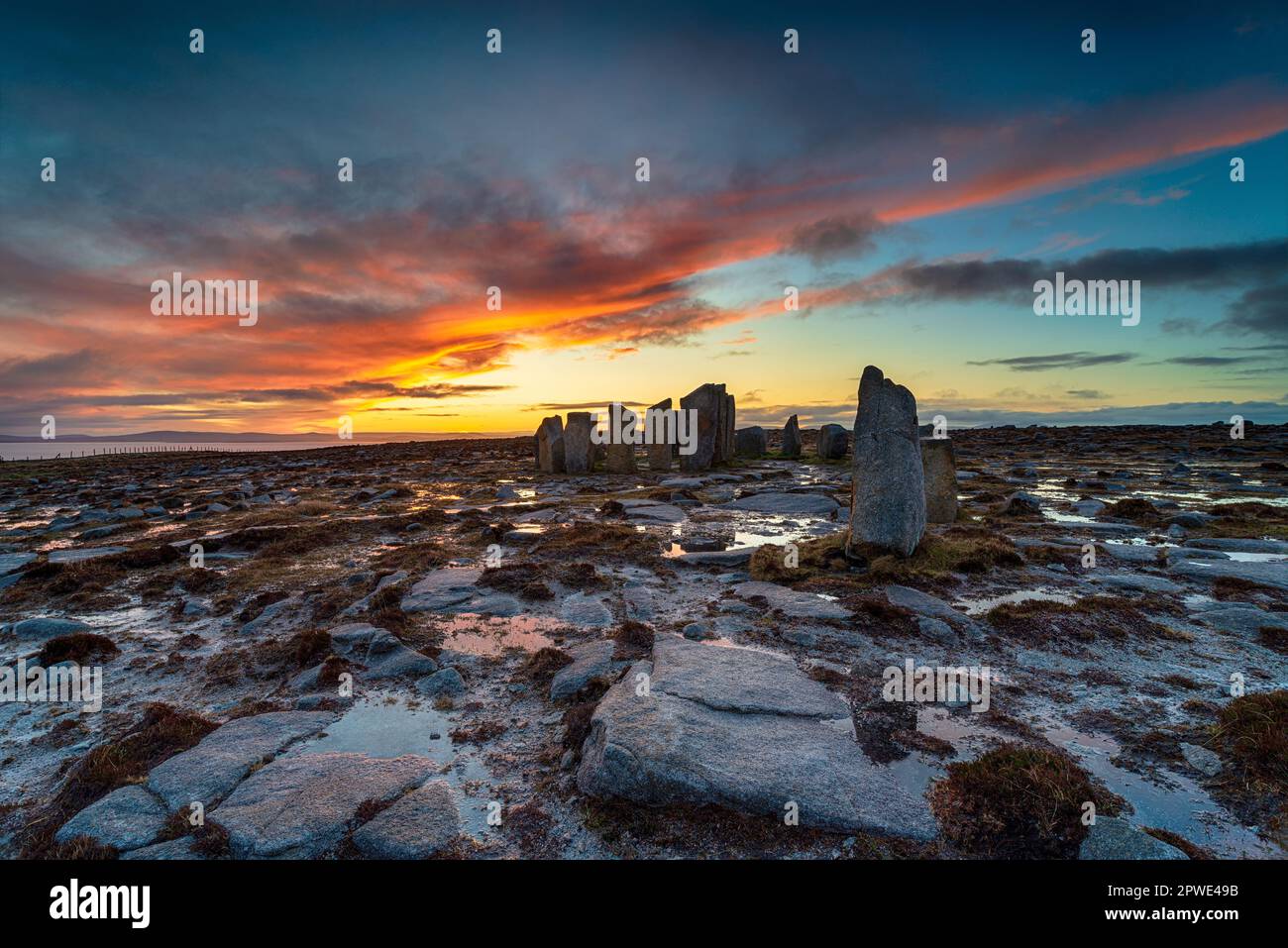 Dramatic sunrise over modern standing stones at Deirbhile's Twist on a ...