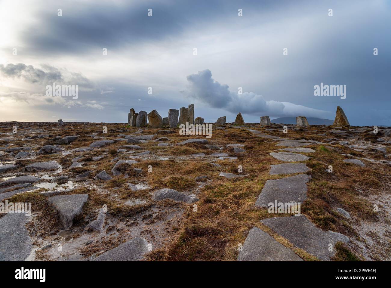 Deirbhile's Twist a modern stone circle under a stormy sky at Falmore ...
