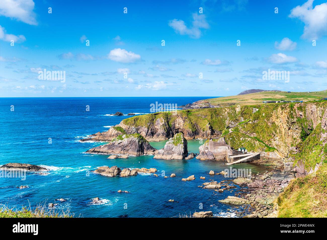 A sunny day at Dunquin Pier on Slea Head and part of the Wild Atlantic ...