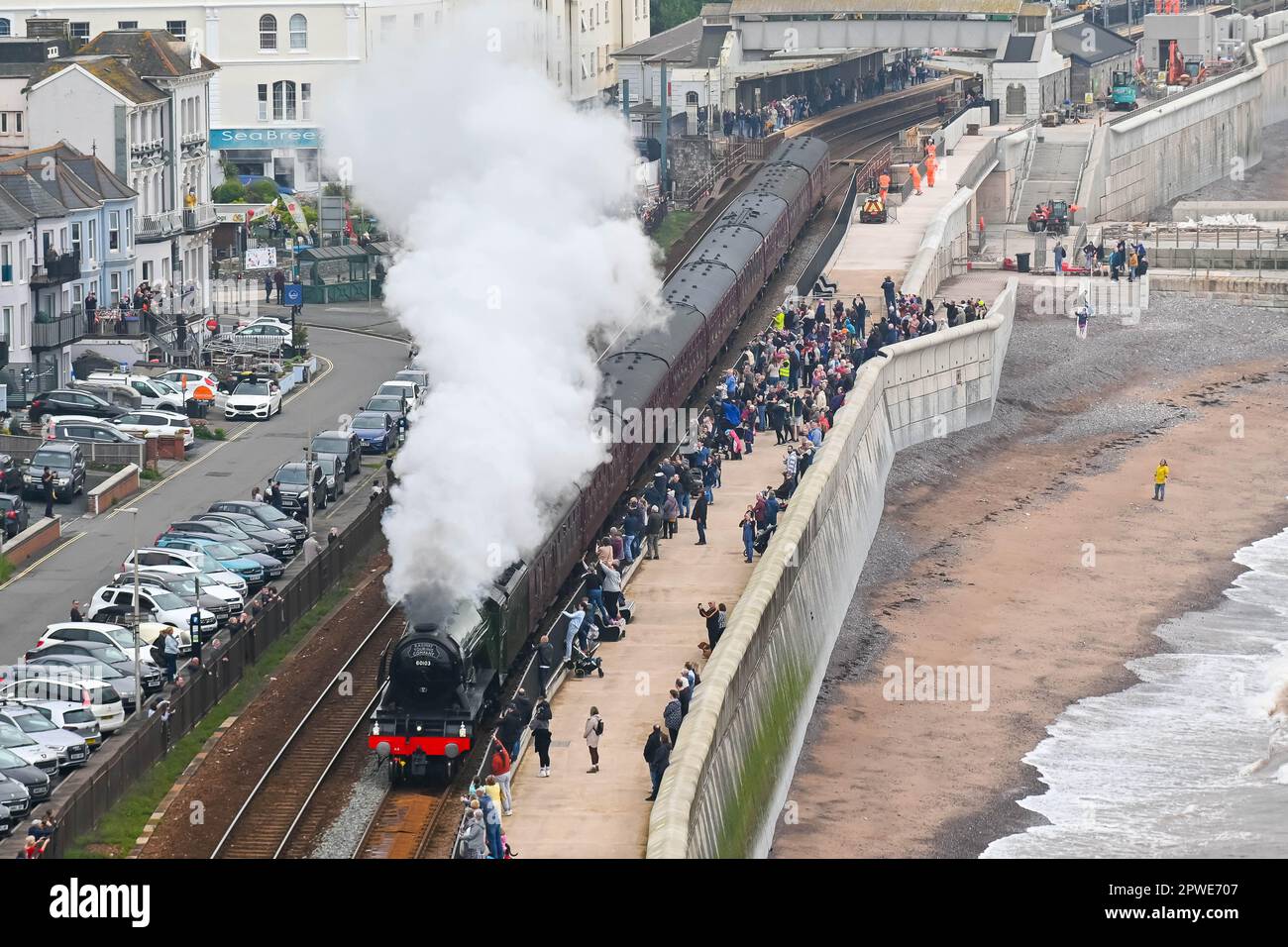 Dawlish, Devon, UK. 30th April 2023. Steam enthusiasts line the sea ...
