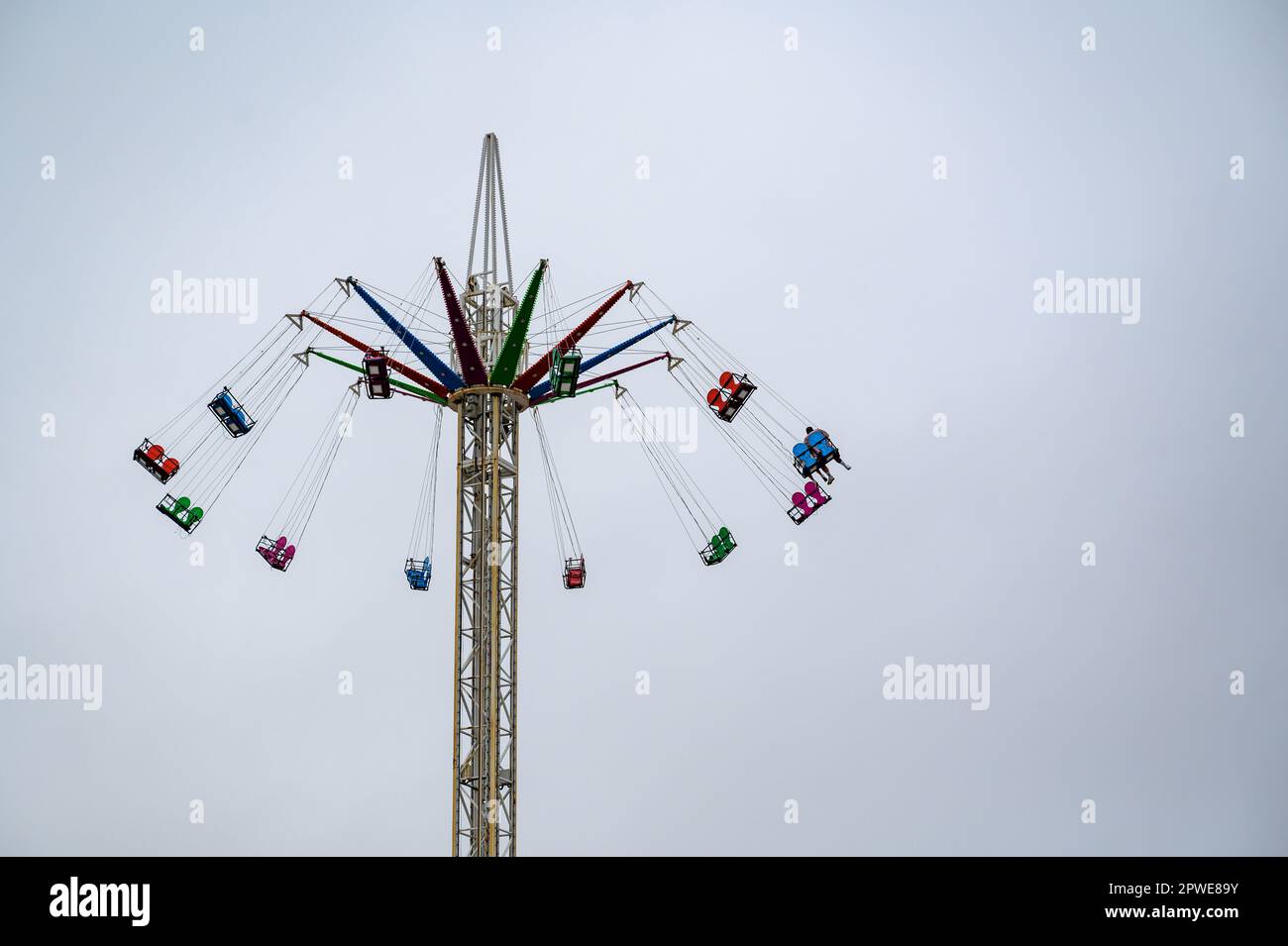 Daytime British colorful carnival fair amusement park rides Stock Photo ...