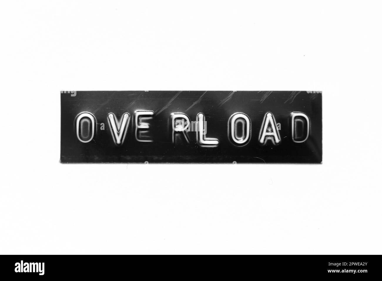 Black color banner that have embossed letter with word overload on ...