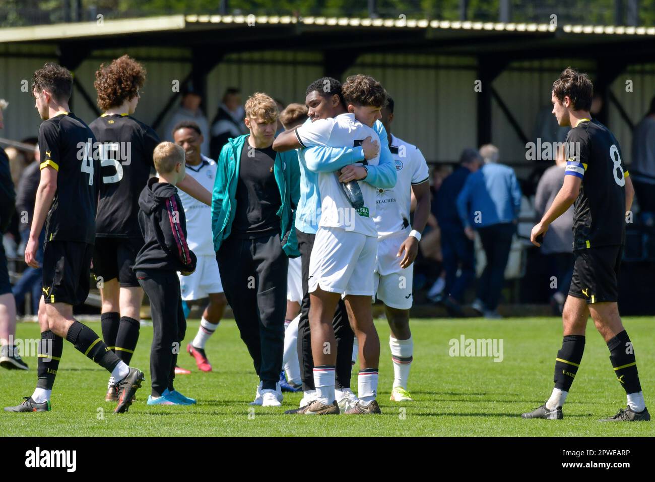 Swansea, Wales. 29 April 2023. Goalkeeper Evan Watts embraces Jada ...