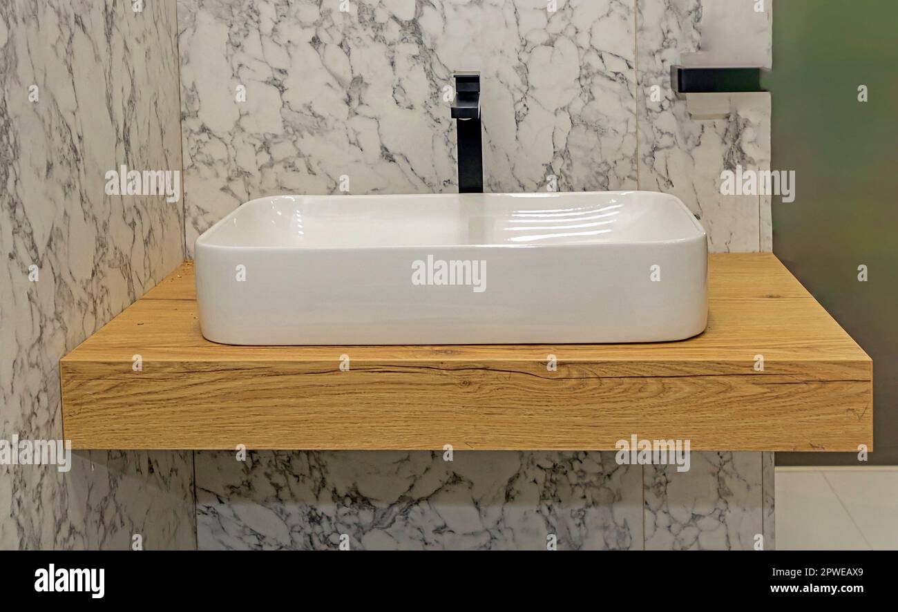 Modern empty bathroom ceramic hand wash basin with decorative tiles ...