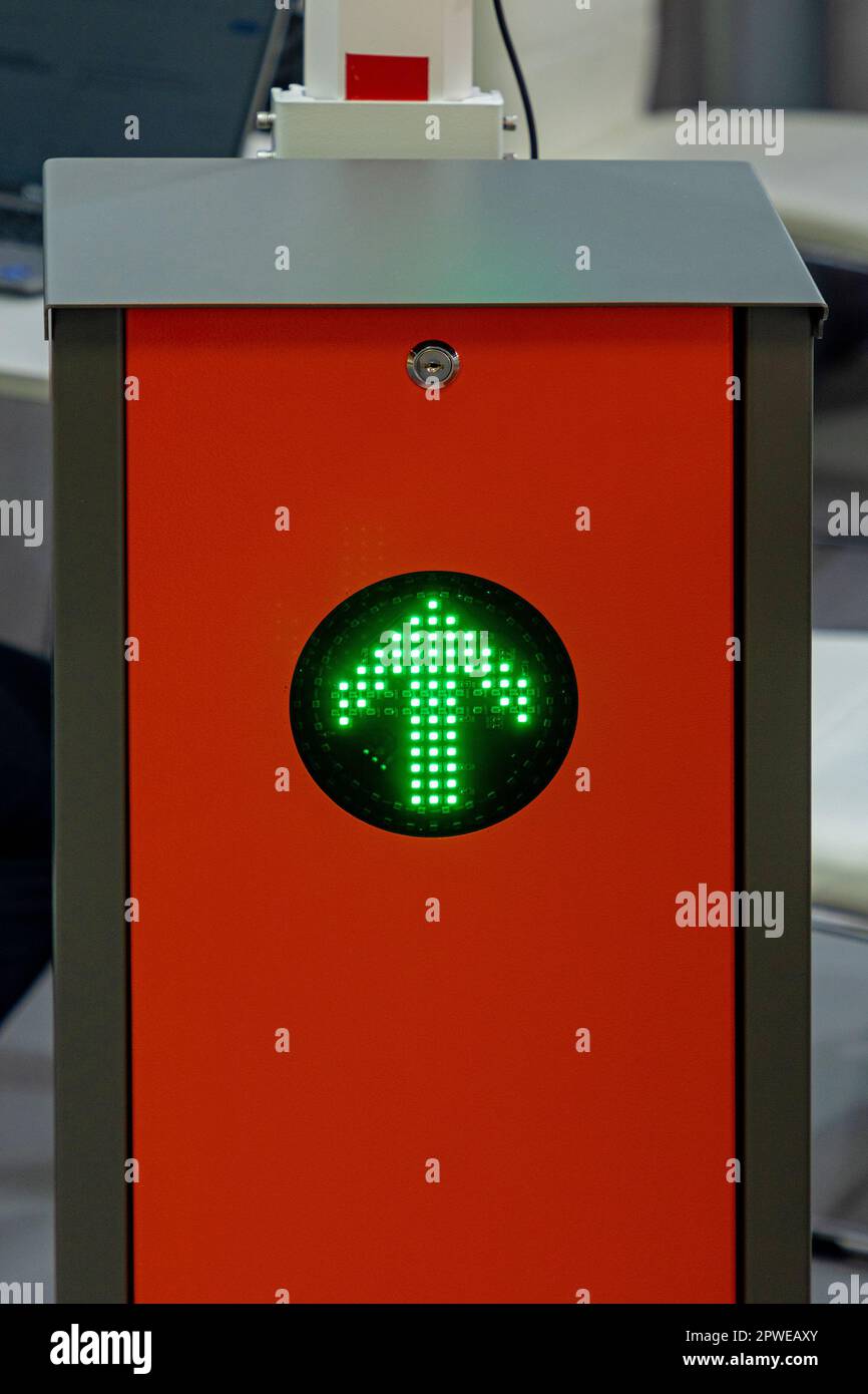 Outdoors entrance ramp with glowing green arrow sign Stock Photo - Alamy