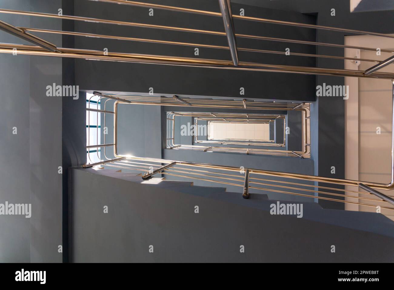 Stairs in a concrete office building in neutral tones, covered with ...