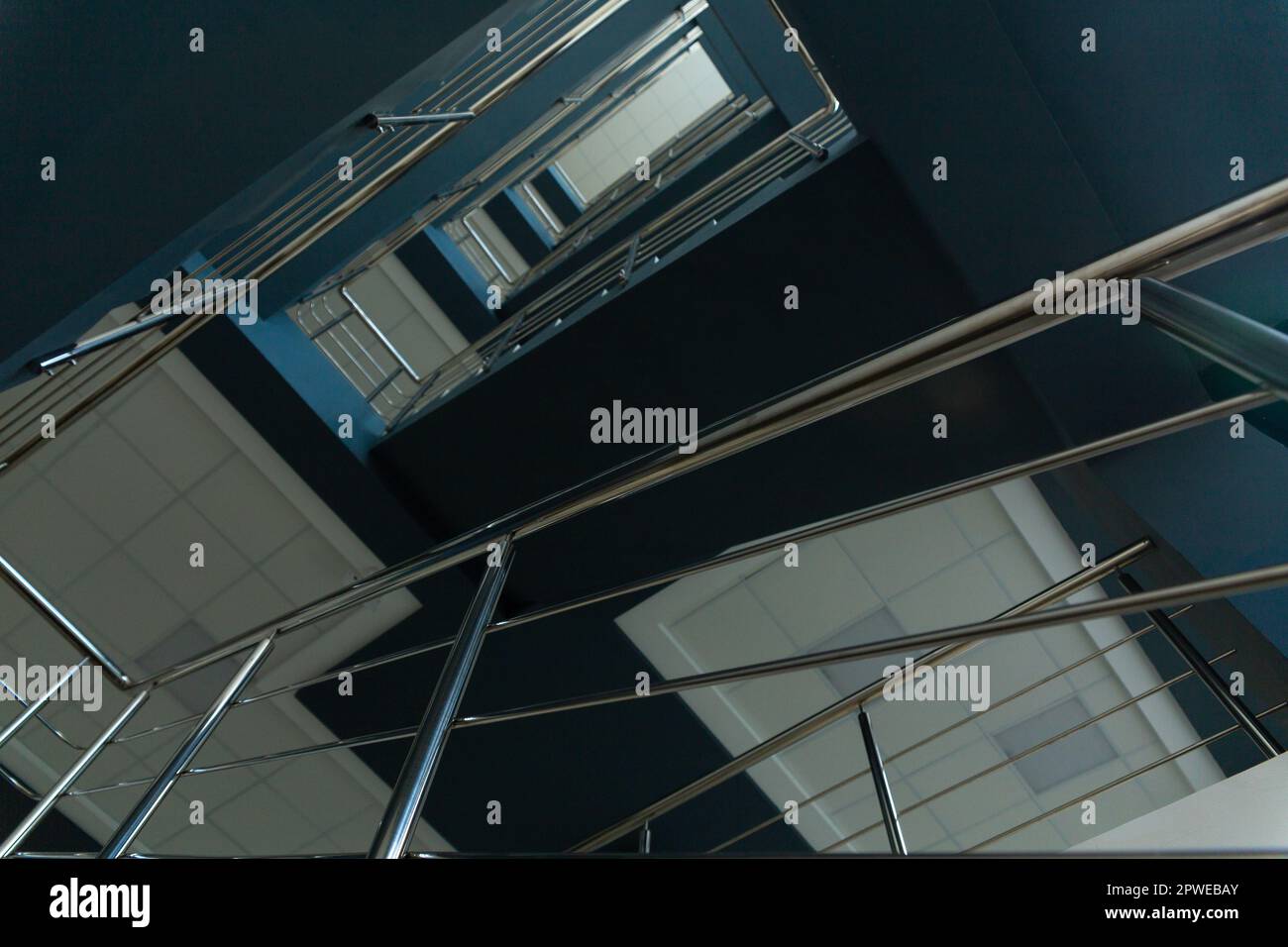 Stairs in a concrete office building in neutral tones, covered with ...