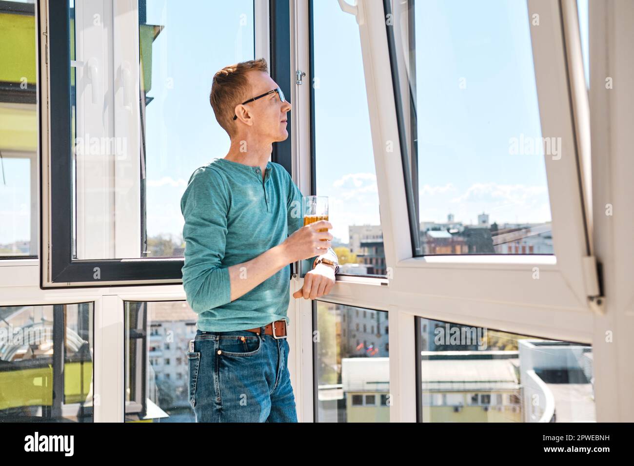 Man stand stands standing on balcony hi-res stock photography and ...
