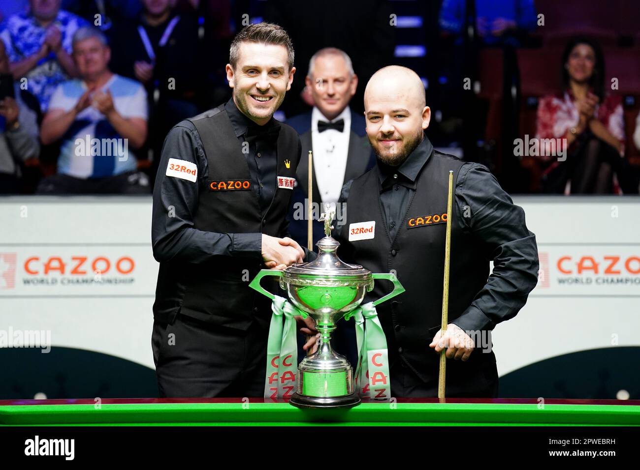 Mark Selby (left) and Luca Brecel (right) shake hands before their ...
