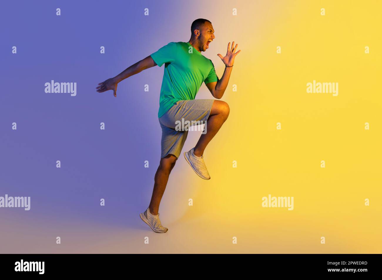 Black Guy Shouting Running Over Blue And Yellow Neon Background Stock ...