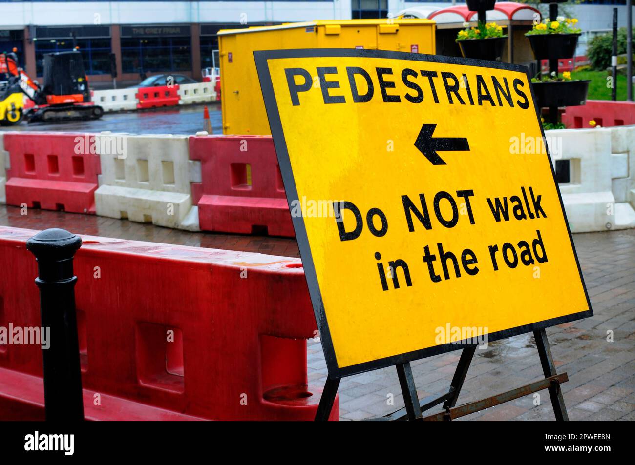 yellow sign for pedestrians Stock Photo - Alamy