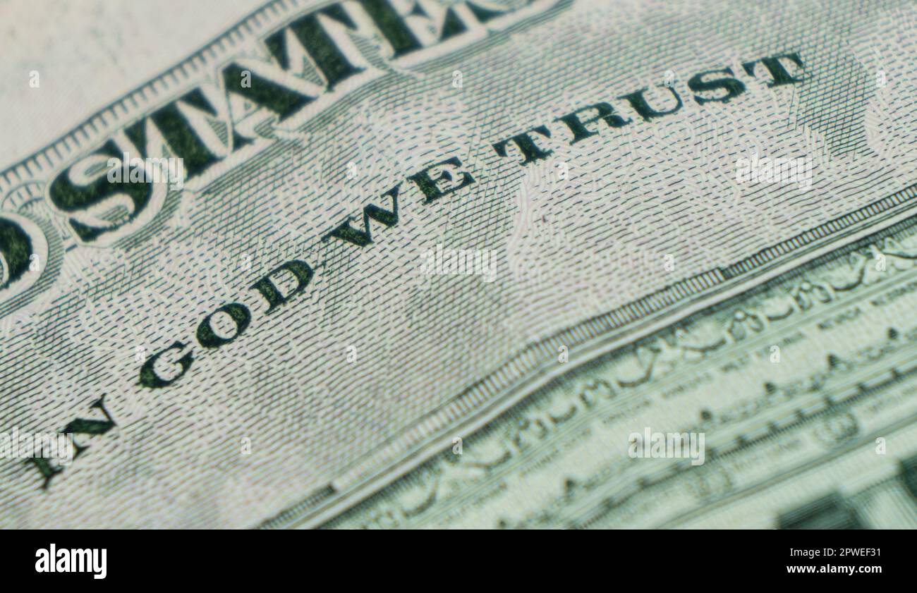 Macro shot image of the phrase in god we trust. Concept of financial ...