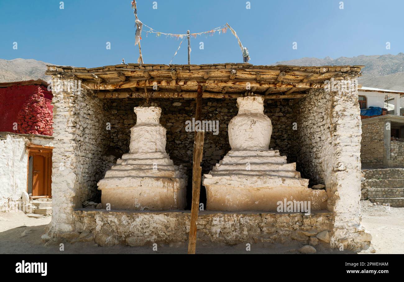 Large Buddhist stupas housed in brick framework inside monastery ...