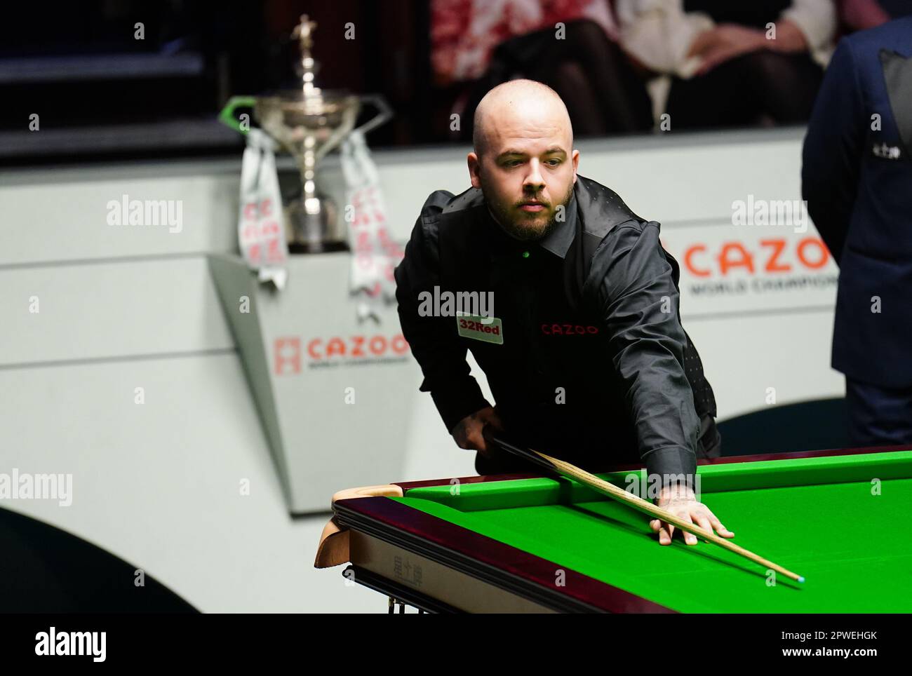 Luca Brecel in action against Mark Selby (not pictured) during the ...