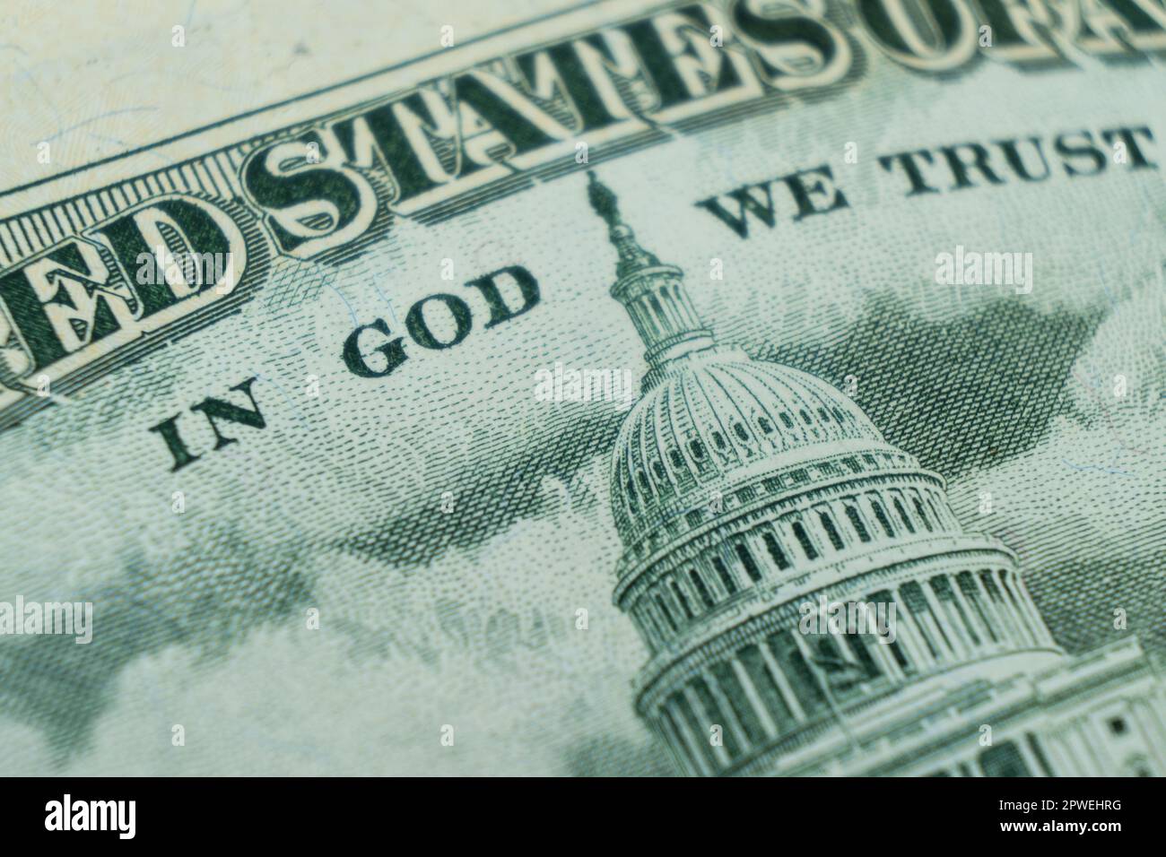 Macro shot image of the phrase in god we trust. Concept of financial ...