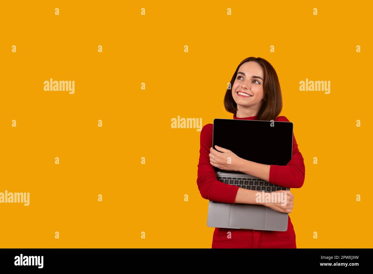 Happy pretty young woman hugging laptop with blank screen Stock Photo ...