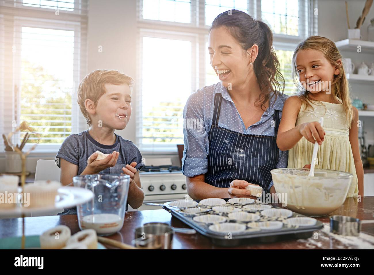 Im here for the cupcakes. a mother baking in the kitchen with her ...