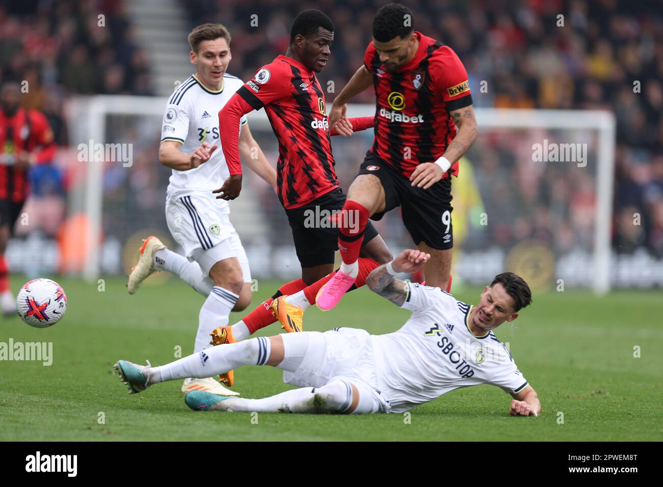 Leeds United’s Robin Koch (below) tackles Bournemouth’s Dominic Solanke ...