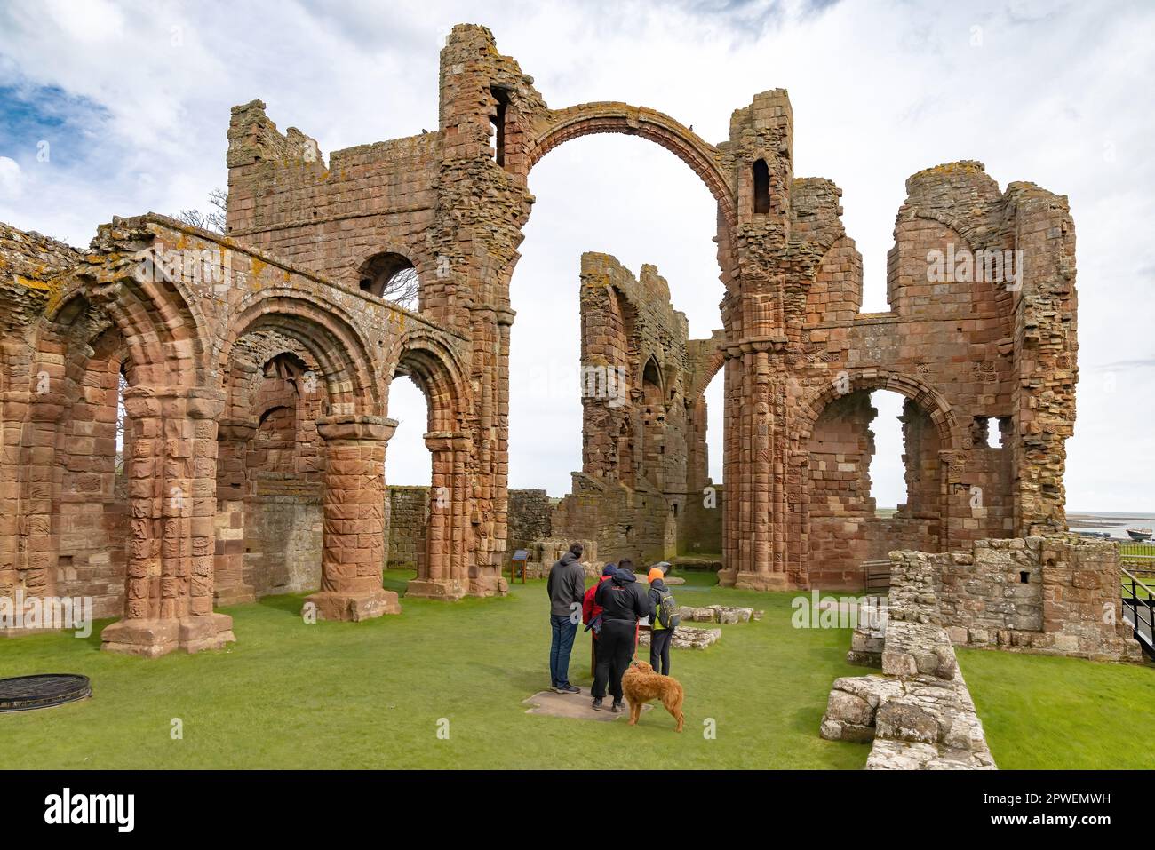Visitors at Lindisfarne Priory, Holy Island Northumberland UK; 7th ...