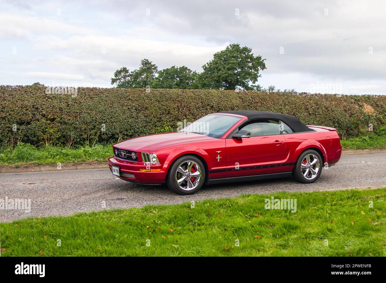 2007 Red Ford Mustang 4000 cc Cabrio; Isolated classic car travelling ...