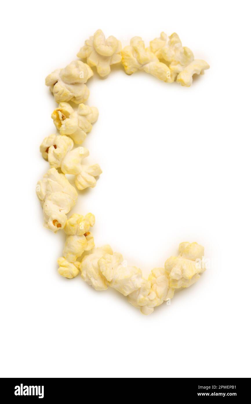 Letter C made of popcorn on white background Stock Photo - Alamy