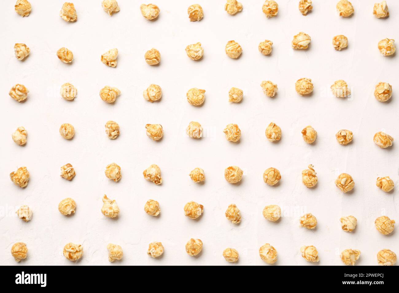 Crispy popcorn on light background Stock Photo - Alamy