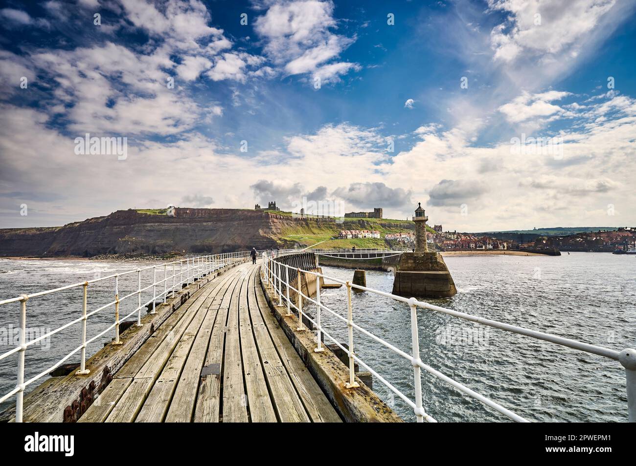 Whitby harbour wall with the abbey and church in the backgound Stock ...