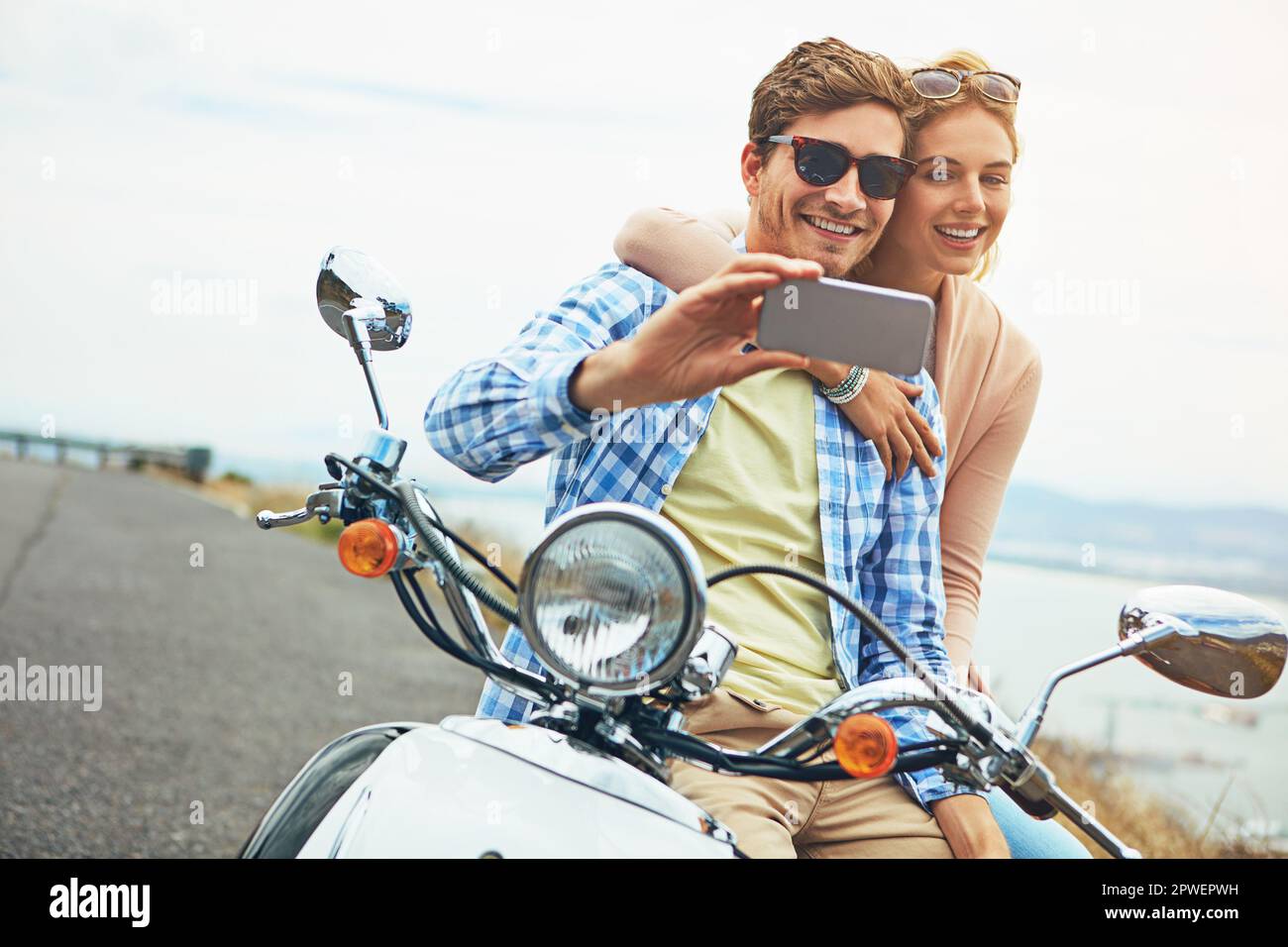 Taking memorable selfies of their adventures. a couple taking a selfie ...