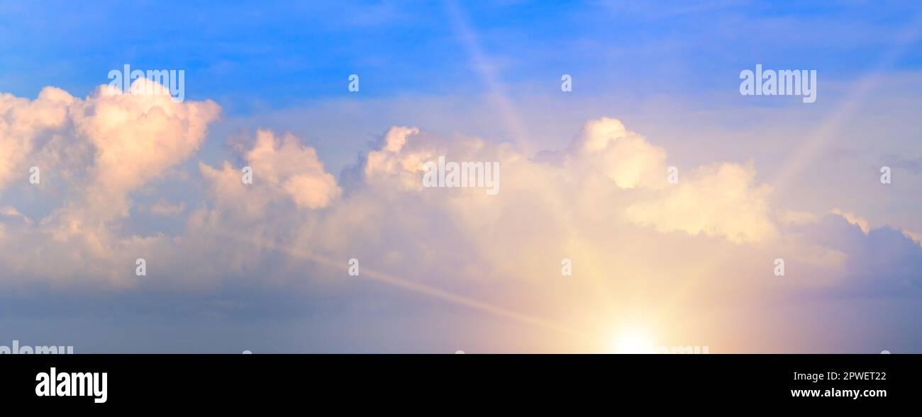 Blue sky with beautiful clouds and bright sunrise. Wide photo Stock ...