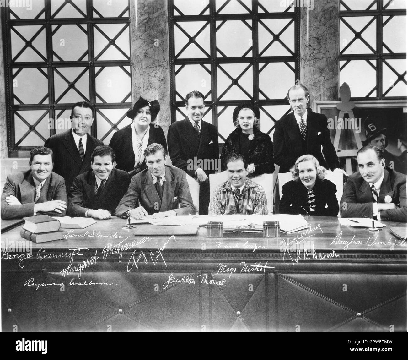 GARY COOPER and JEAN ARTHUR with director FRANK CAPRA and the principal ...