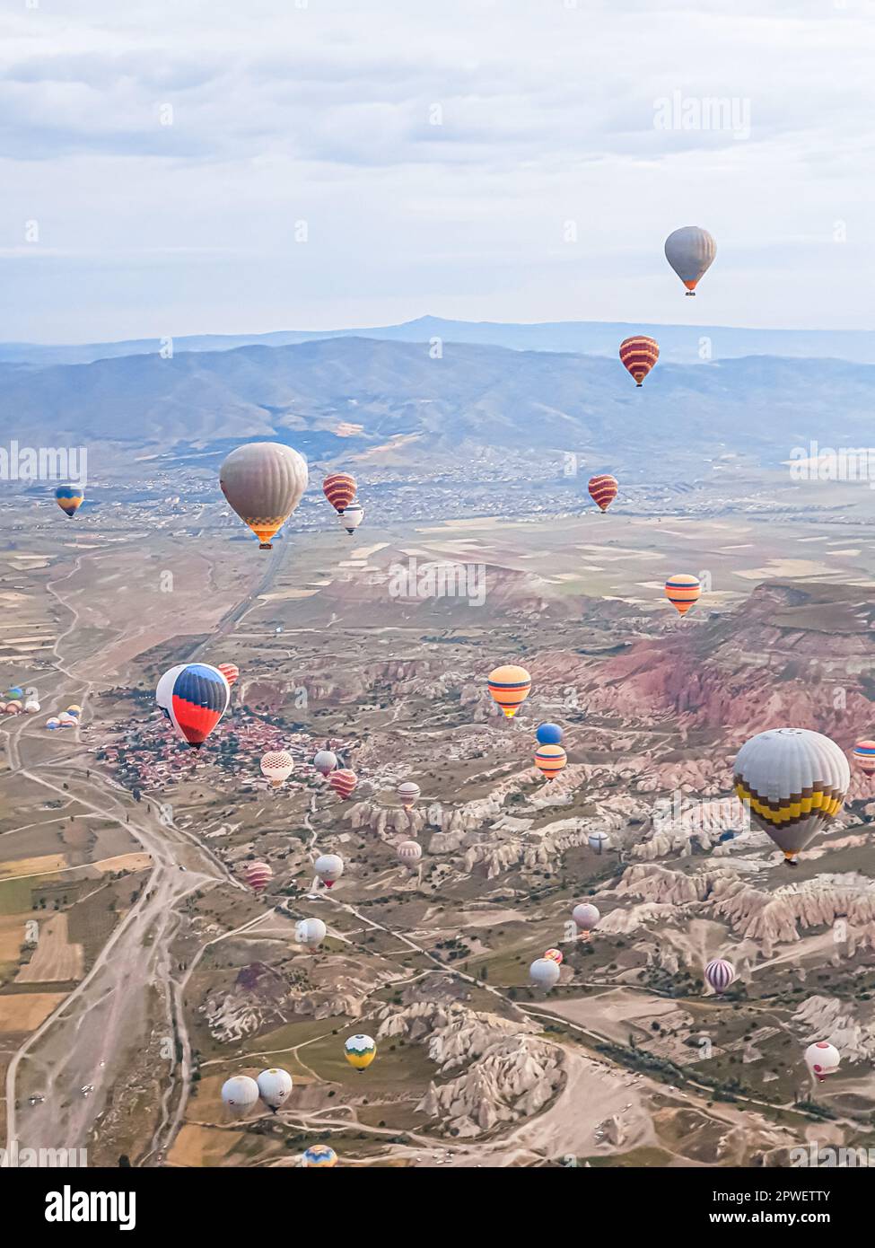 Process of launching many colored beautiful balloons into air in ...