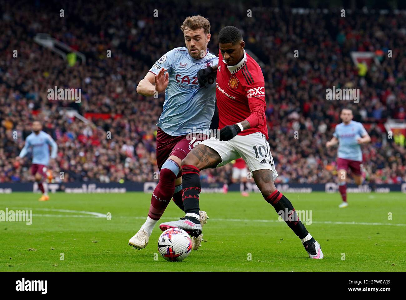 Aston Villa's Calum Chambers battles for the ball with Manchester ...