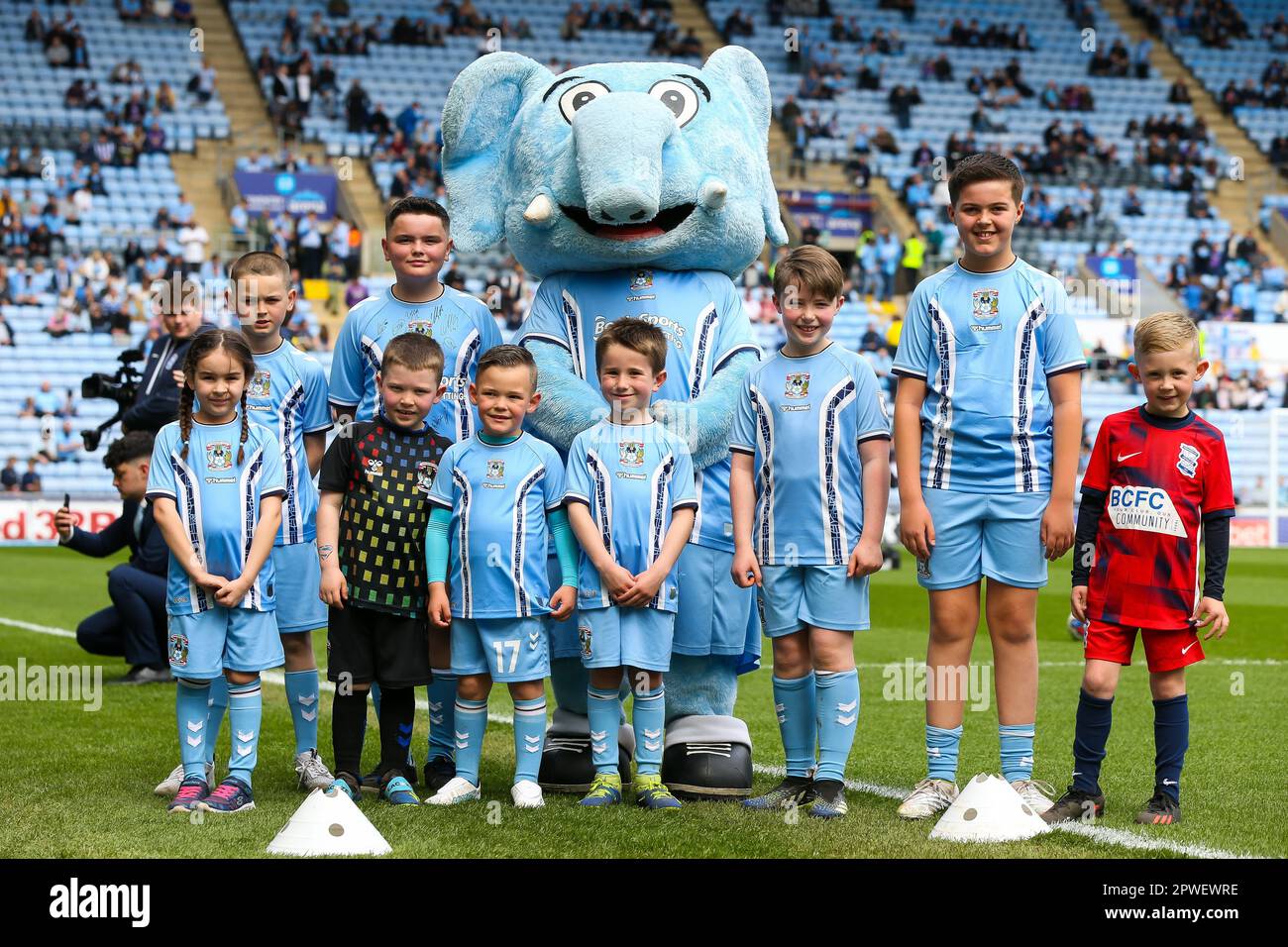 Coventry City's Sky Blue Sam poses for a photo with match day mascots ...