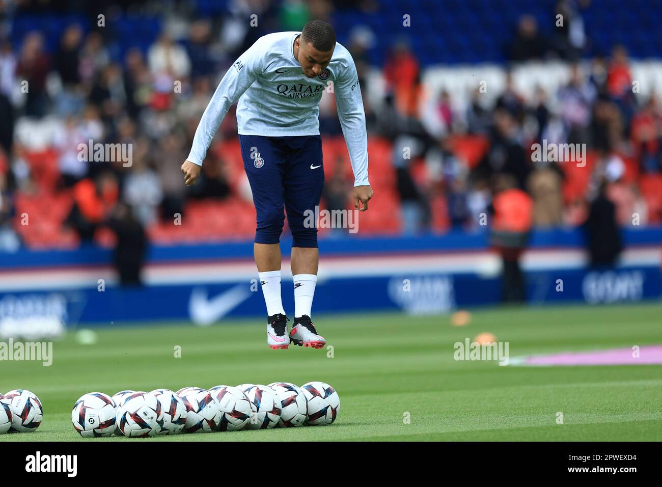PSG's Kylian Mbappe jumps as he warms up before the French League One ...