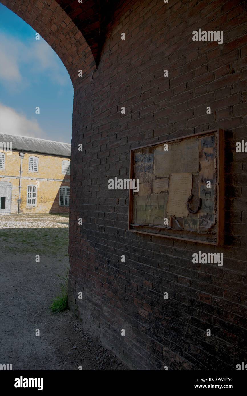 Old Noticeboard on the arch wall at Calke Abbey Stables and ...