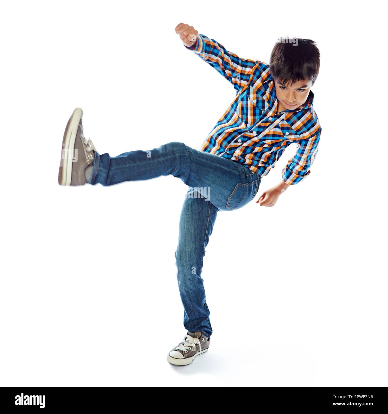 Busting a move. Studio shot of a young boy dancing against a white ...
