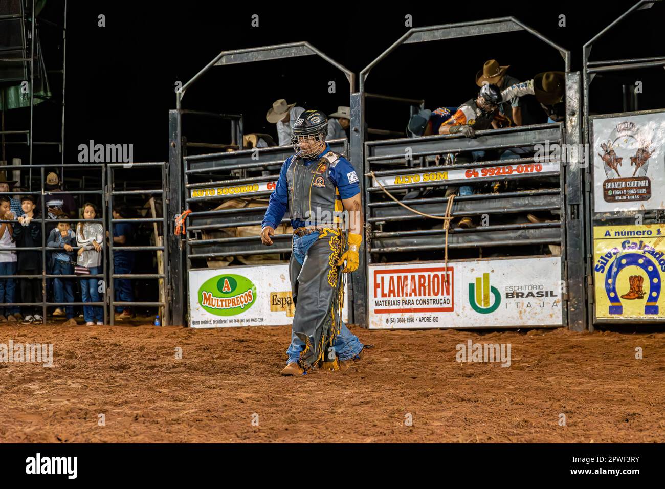 Itaja, Goias, Brazil - 04 22 2023: Person at a bull riding event in a ...