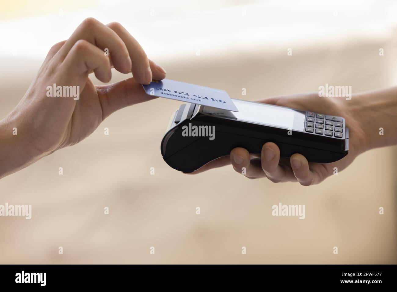 Customer hold card makes easy payment on card reader machine Stock ...