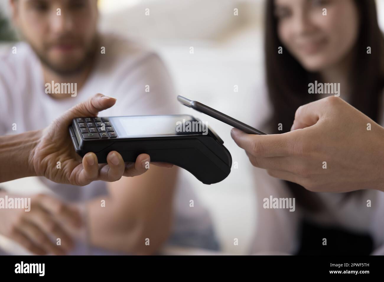 Client makes payment by smartphone app, close up Stock Photo - Alamy