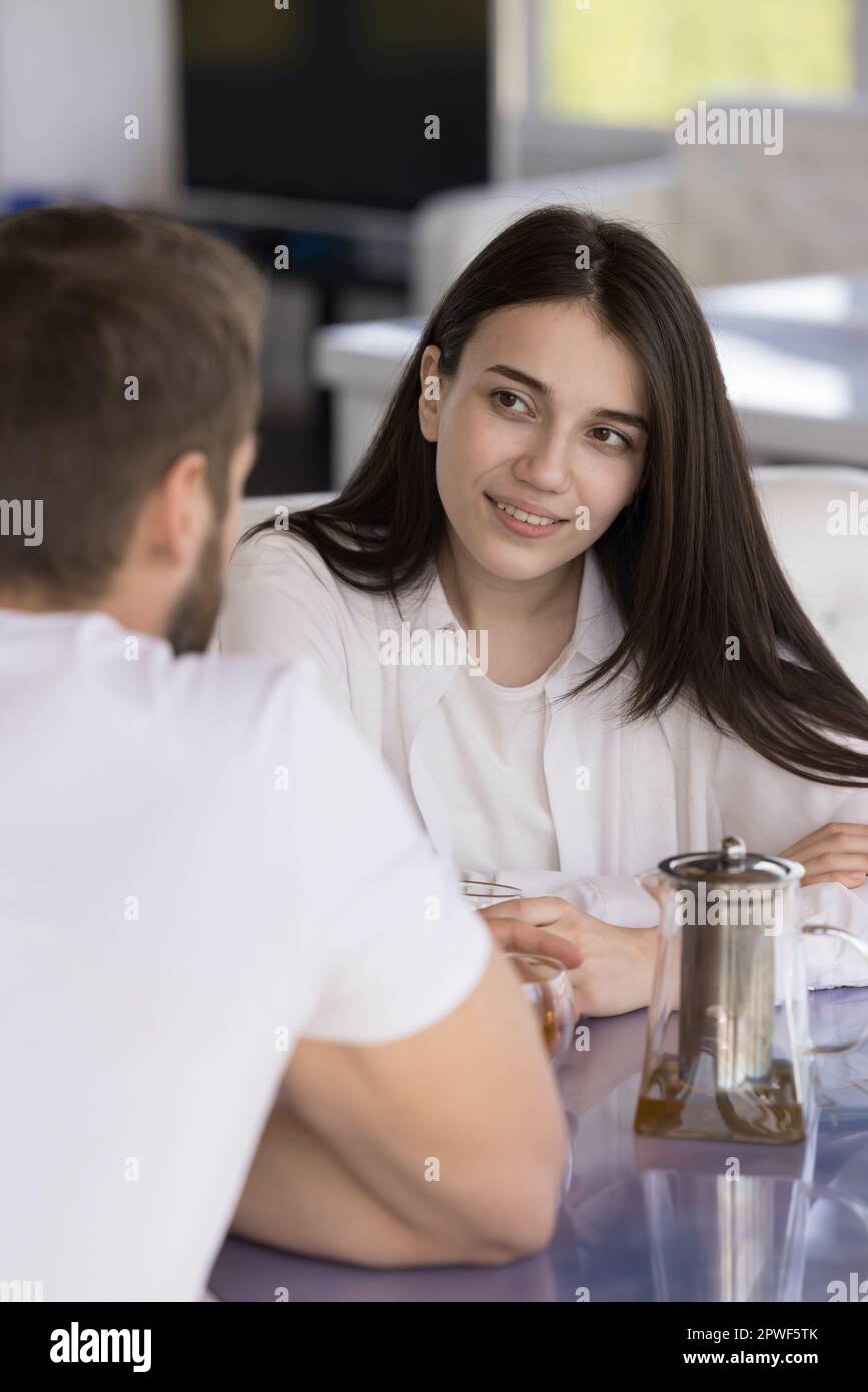 Beautiful woman drink tea, enjoy talk with boyfriend in cafe Stock ...